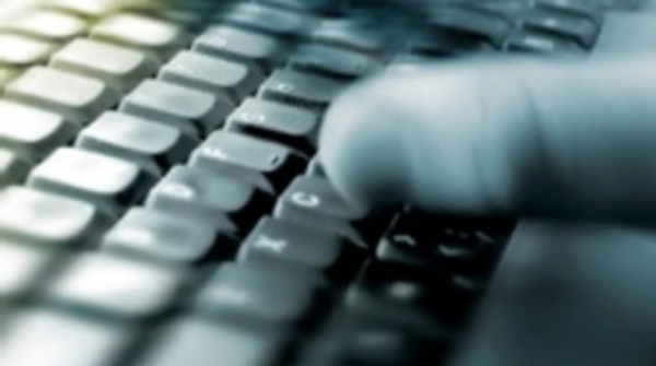 moving hand on typewriter | Ghost Press Writing Services